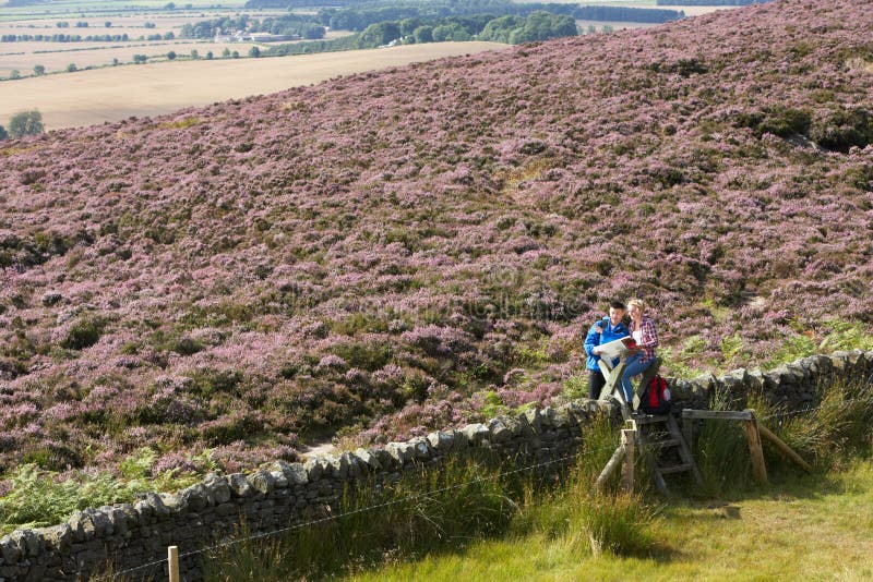 Young Couple Hiking through Countryside Stock Photo - Image of nature ...