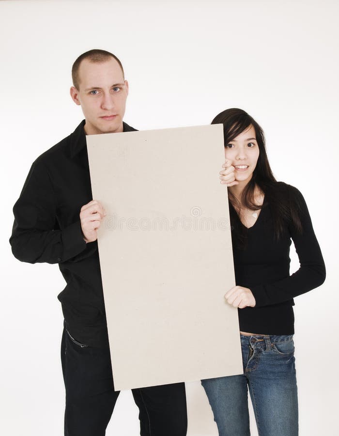 Young Couple Holding a Sign Stock Photo - Image of isolated, caucasian ...