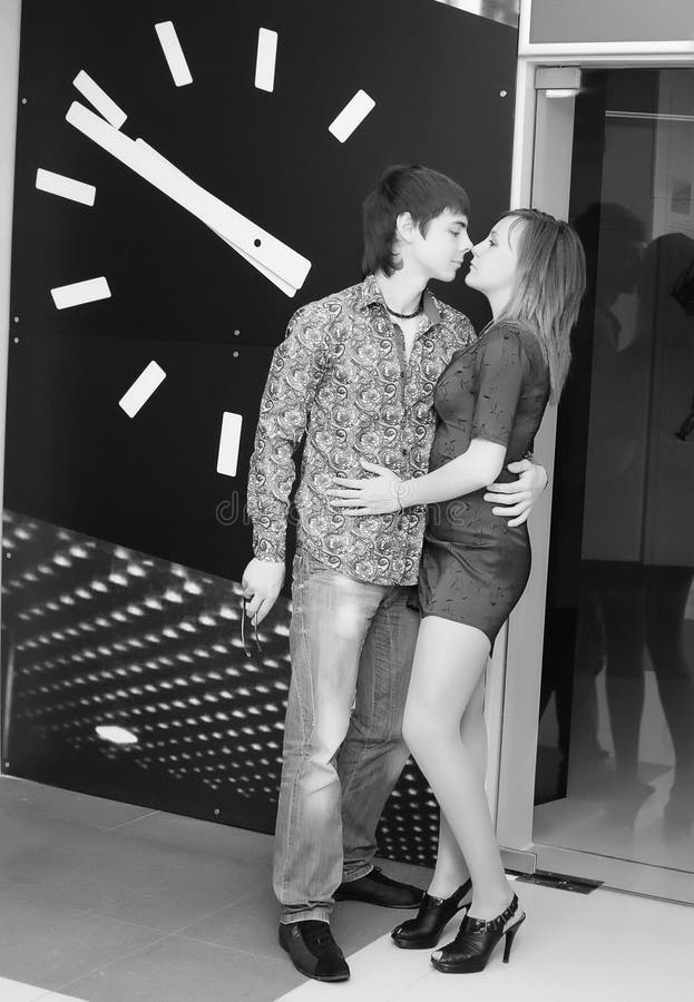 Young Couple Hugging by Clock Stock Image - Image of hight, young: 19454985
