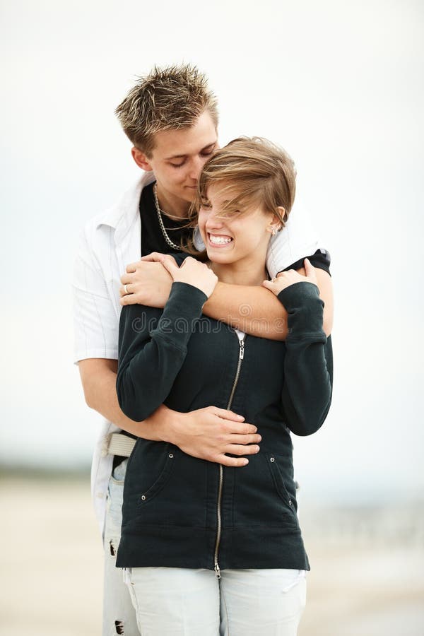 Young Couple Kissing on Beach Stock Photo - Image of outside, details ...