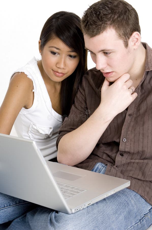 Couple using Laptop stock image. Image of notebook, internet - 771821