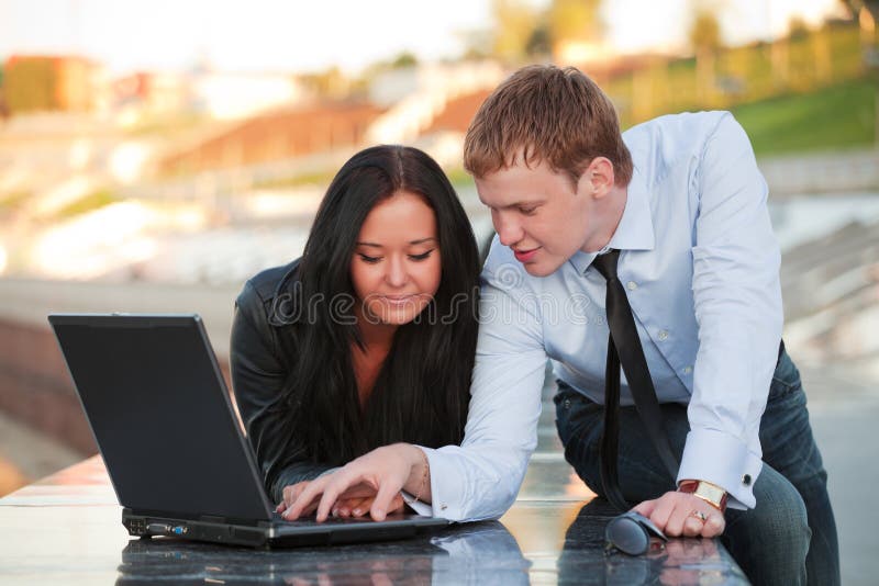 Young couple with laptop. stock image. Image of business - 17352207