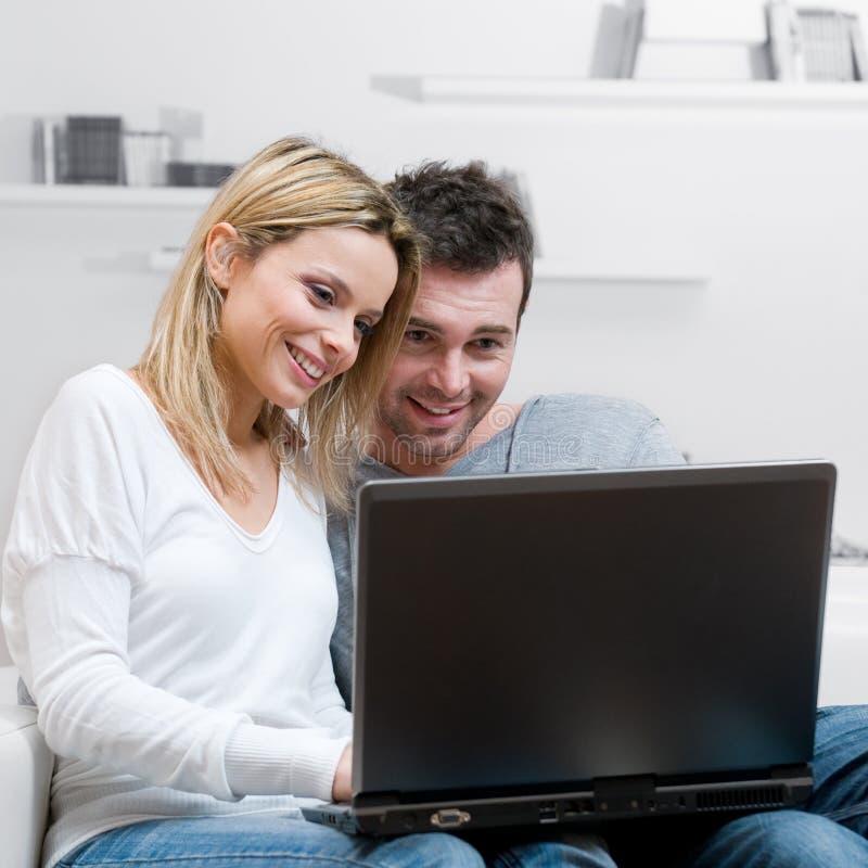 Couple with Laptop stock photo. Image of finding, news, paper - 84492