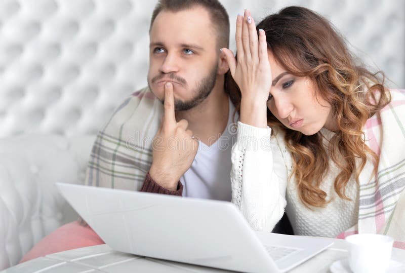 Young couple with laptop stock image. Image of attractive - 82340543