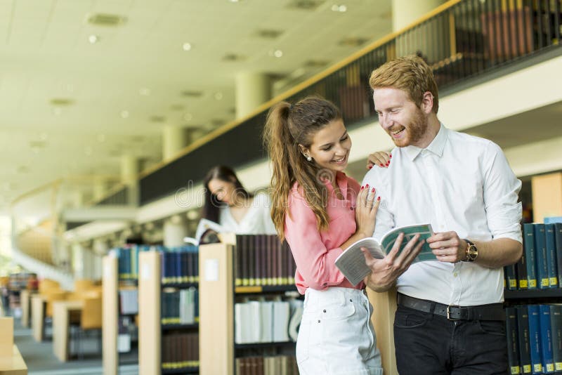 Young Couple in the Library Stock Image - Image of indoor, books: 59293107