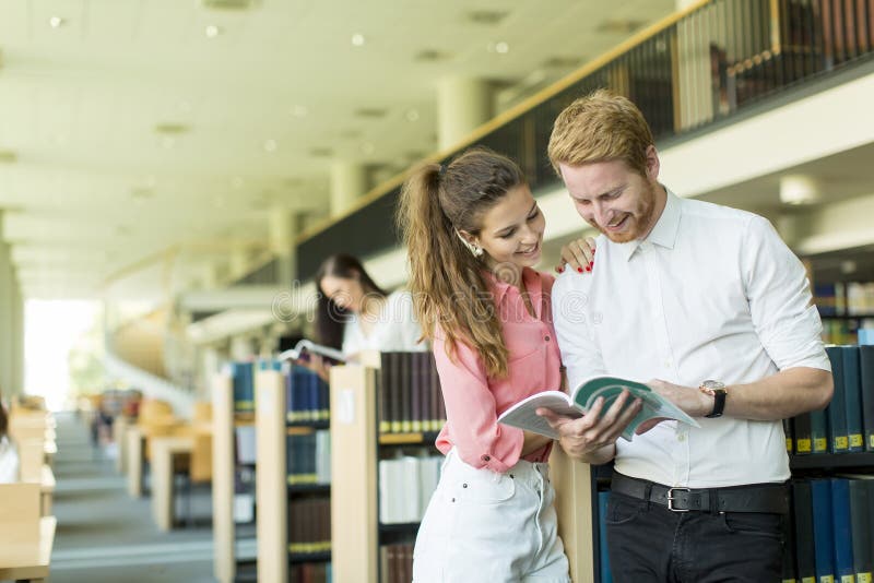 Young Couple in the Library Stock Image - Image of people, study: 60930055