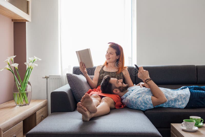 Young Couple in the Living Room Stock Photo - Image of home, coffee ...