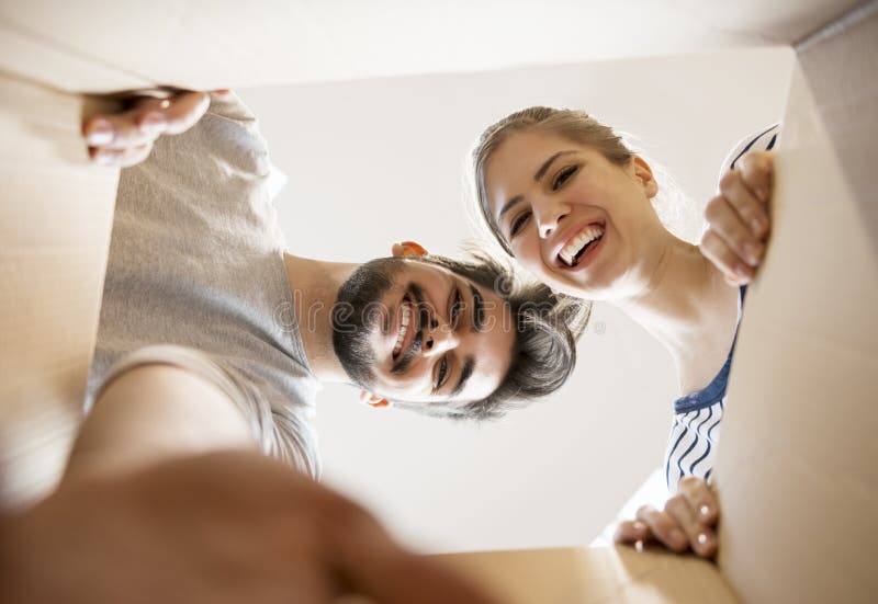 Young Couple Looking into the Box Stock Image - Image of couple, post ...