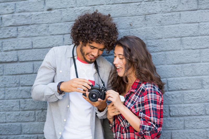 Young Couple Looking in Camera Stock Photo - Image of cheerful, female ...