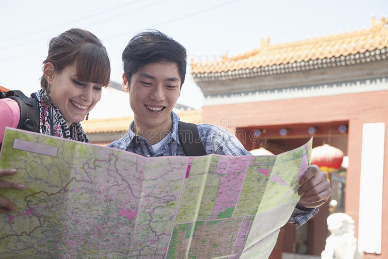 Five People Looking at Map with Tiananmen Square in Background. Stock ...