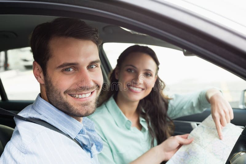 Young Couple Looking at the Map Stock Photo - Image of pretty, male ...
