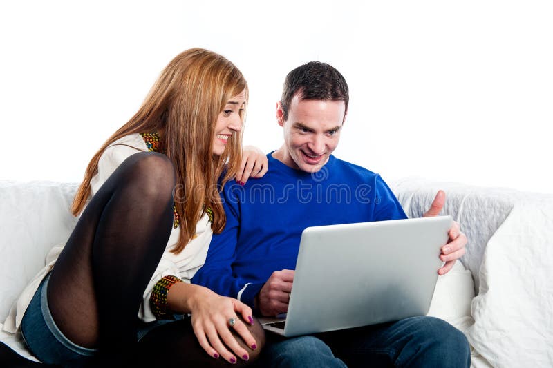 Couple Thinking and Looking at a Laptop Computer Stock Photo - Image of ...