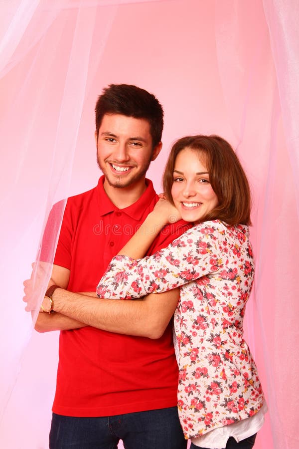 Young Couple in Love on a Background of Pink Tulle Stock Photo - Image ...