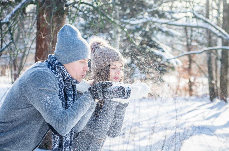 Young Couple in Love Blows Snow Stock Image - Image of laugh, love ...