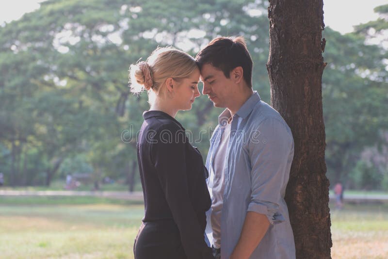 Young Couple in Love, Hugging Under the Tree in the Park Stock Image ...