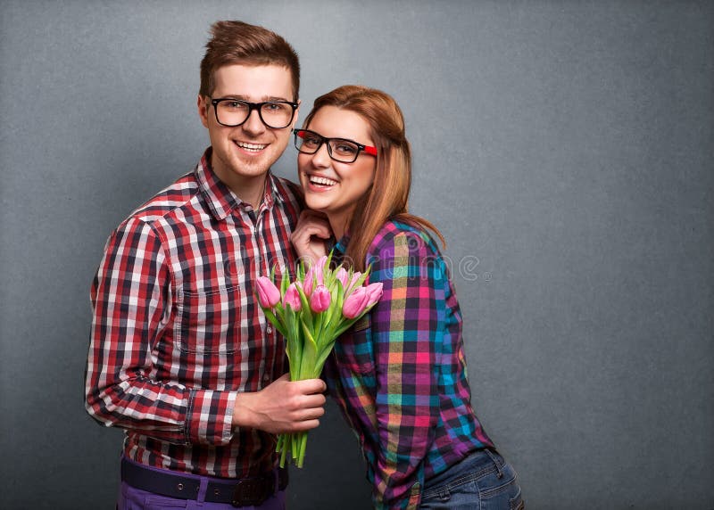 Young Couple in Love Make a Heart and Hands are Holding Tulips. Stock ...