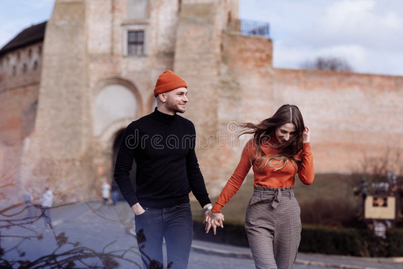 In Love Stylish Young Couple Kissing in the City. Fashion Outdoor ... In Love Stylish Young Couple Kissing in the City. Fashion Outdoor ...