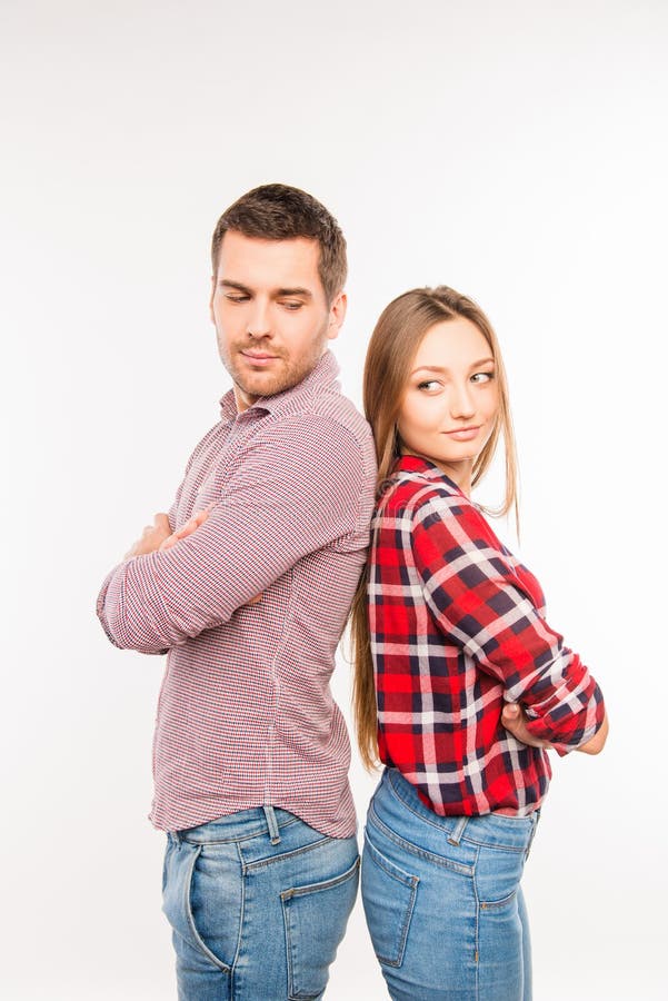 Young Couple in Love Standing Back To Back with Crossed Hands Stock ...