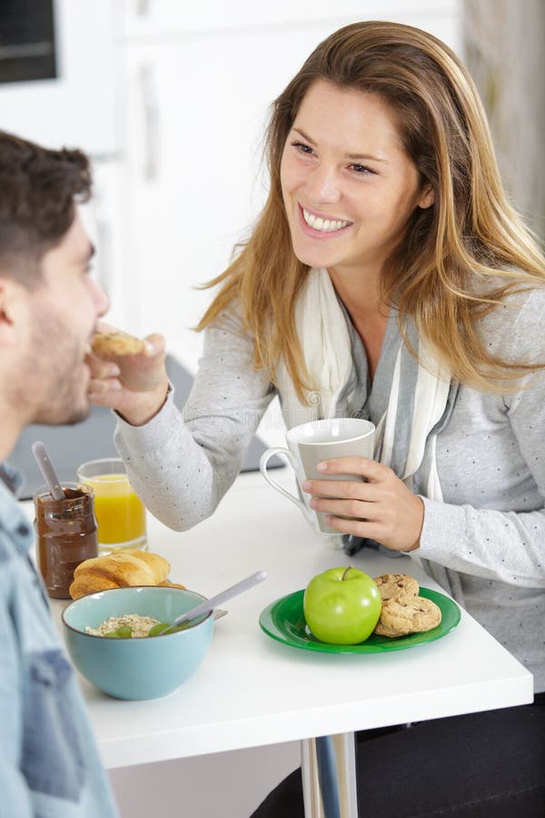 Young Couple Making Breakfast and Having Fun Stock Photo - Image of ...