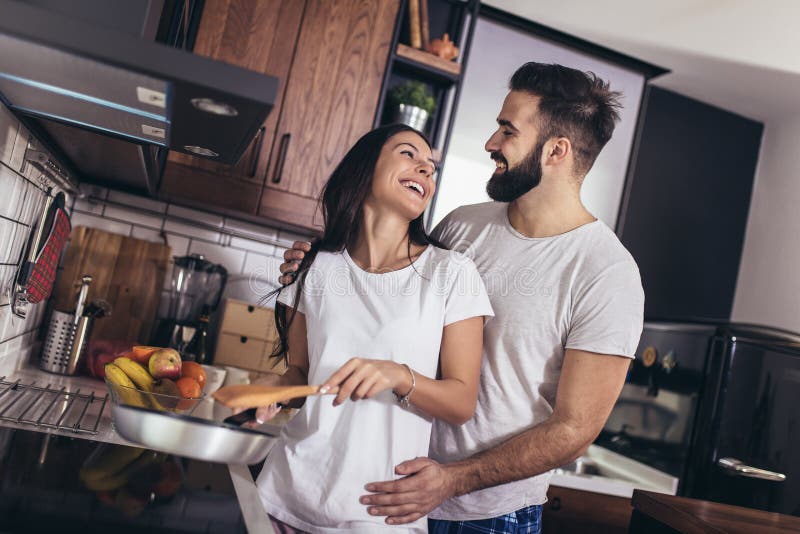 Couple Making Breakfast at Home. Loving Couple Having Fun in Kitchen ...
