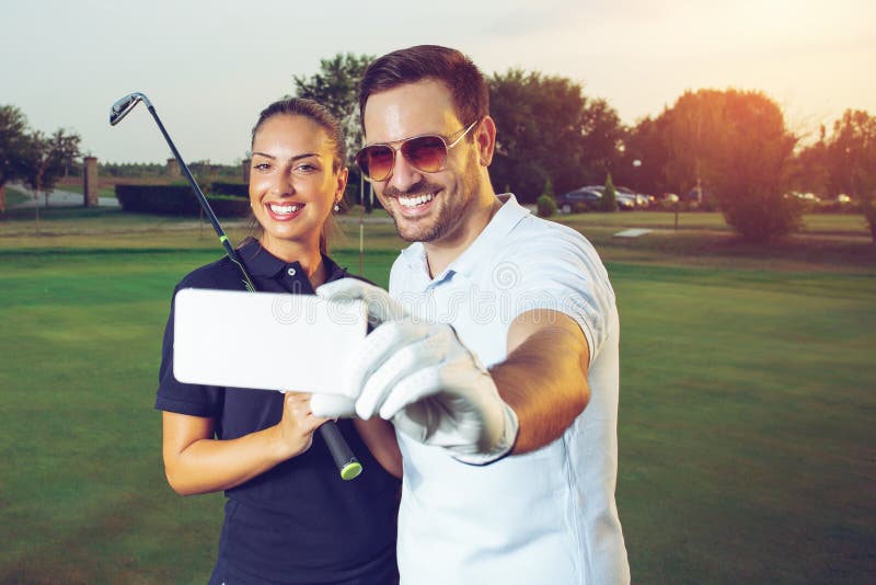 Young Couple Making Selfie on a Golf Course Stock Photo - Image of ...
