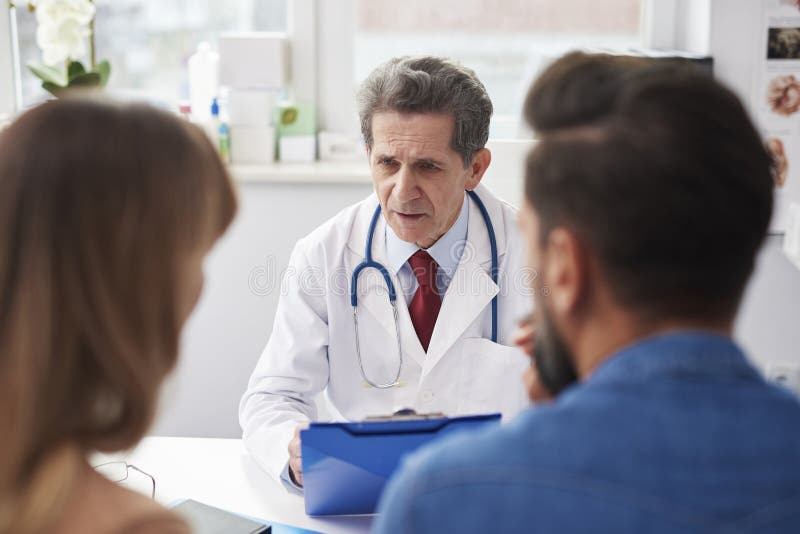 Couple on a medical visit stock image. Image of huge - 214192135