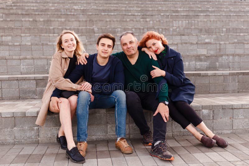 Young Couple and Middle-aged Parents Look into the Camera Stock Image ...