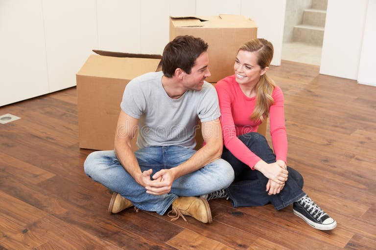 Young couple on moving day stock photo. Image of happy - 18044378