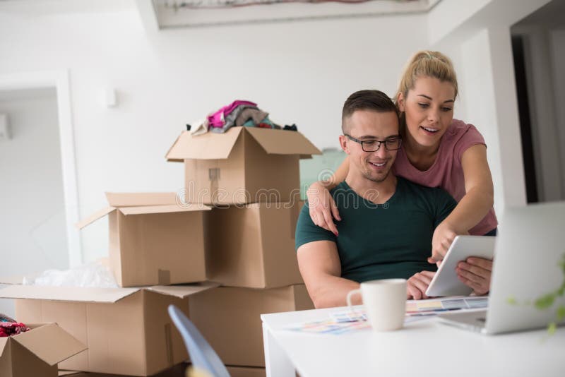 Young Couple Moving in a New Home Stock Photo - Image of owner, looking ...
