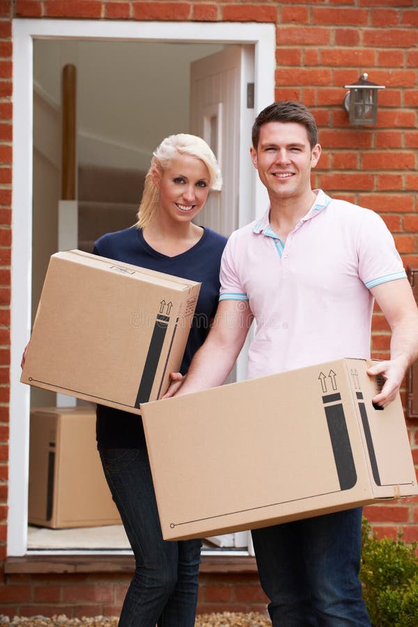 Young Couple Moving into New Home Together Stock Photo - Image of ...