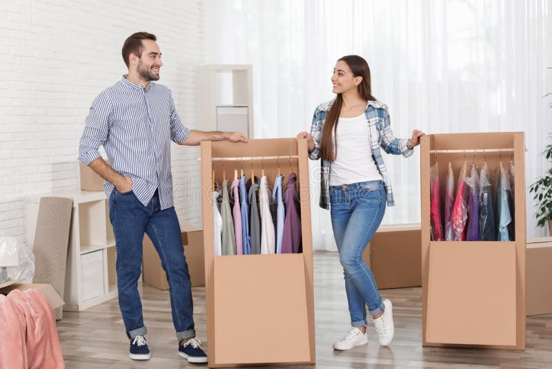 Young Couple Near Wardrobe Boxes Stock Image - Image of clothing, house ...