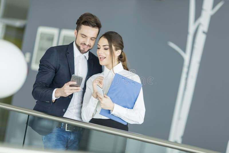 Young couple in the office stock photo. Image of adult - 52704330