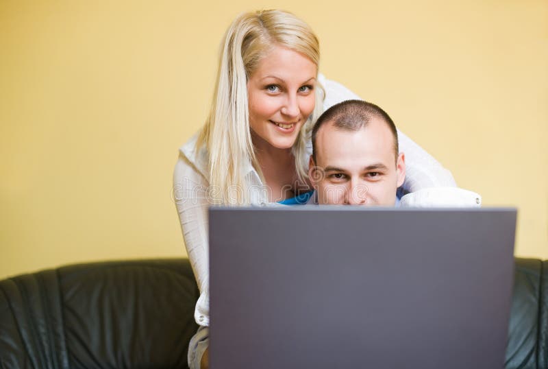 Young Couple Peeking Over Laptop Screen Stock Image - Image of gorgeous ...