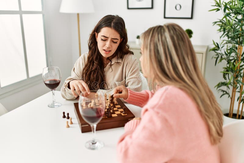 Young Couple Playing Chess Drinking Red Wine at Home Stock Photo ...