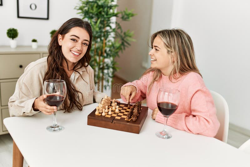 Young Couple Playing Chess Drinking Red Wine at Home Stock Image ...