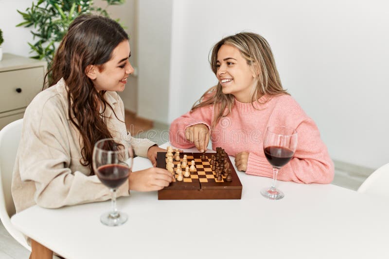 Young Couple Playing Chess Drinking Red Wine at Home Stock Photo ...