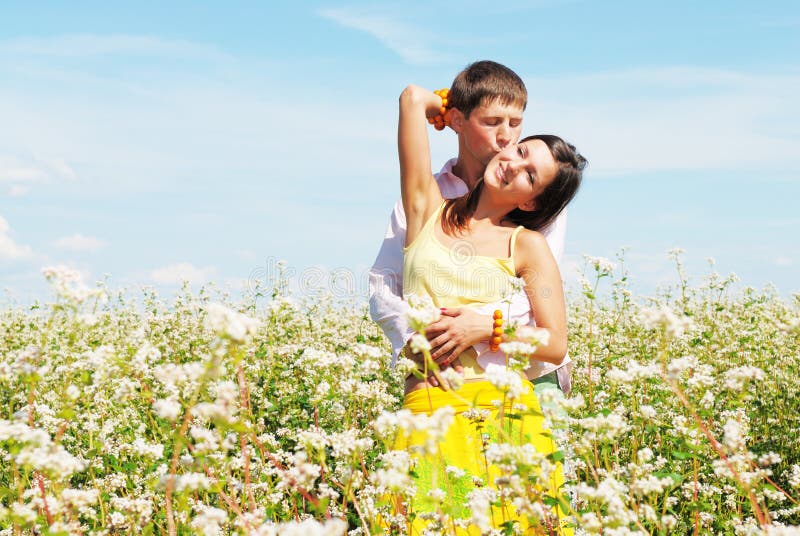 Young Couple Playing on Field of Flowers Stock Photo - Image of grass ...