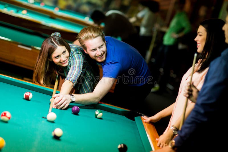 Young couple playing pool stock image. Image of women - 54443039