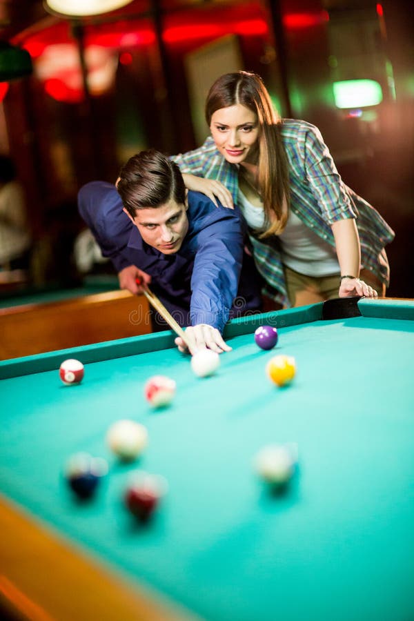 Young couple playing pool stock photo. Image of shooting - 53197308