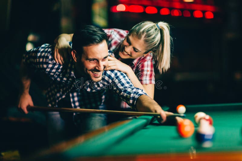 Young Couple Playing Snooker Together in Bar Stock Image - Image of ...