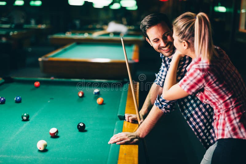 Young Couple Playing Snooker Together in Bar Stock Image - Image of ...