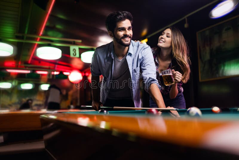 Young Couple Playing Snooker Together in Bar Stock Image - Image of ...