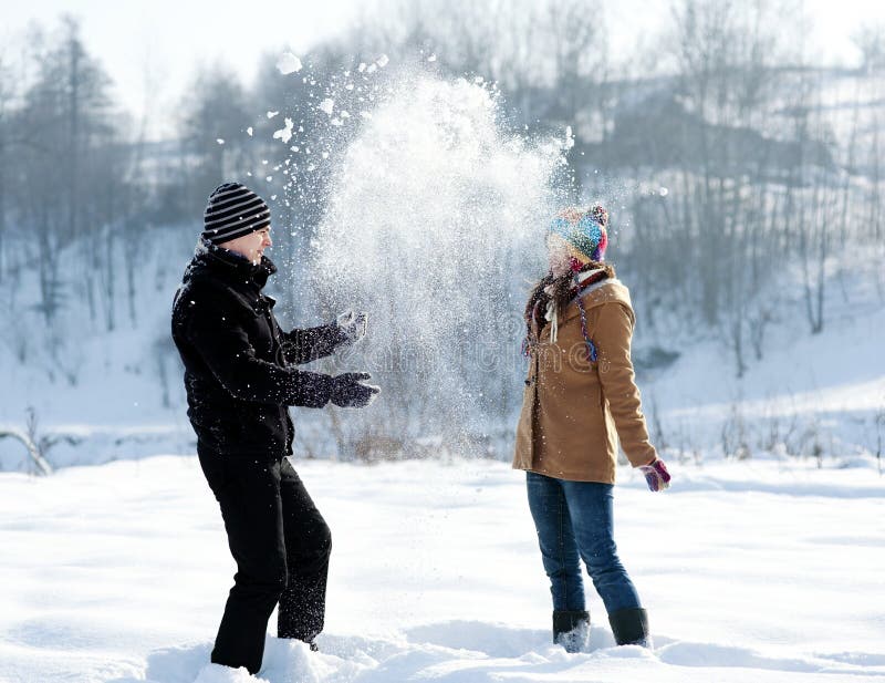 Young Couple Sledding on Snow Stock Photo - Image of love ...