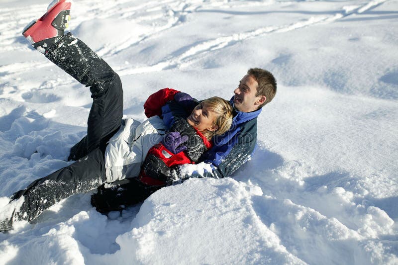Young Couple Playing in the Snow Stock Photo - Image of laughing, love ...