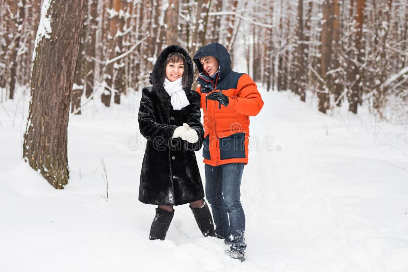 Young Couple Playing in Snow, Having Snowball Fight Stock Image - Image ...