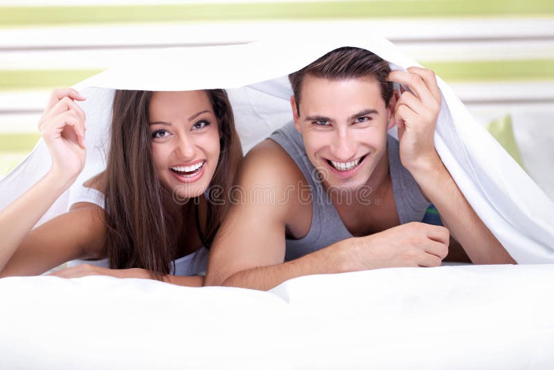 Young Couple Playing Under the Sheets Stock Photo - Image of love ...
