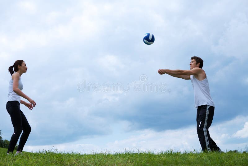 Young Couple Playing Valleyball in Park Stock Image - Image of rest ...
