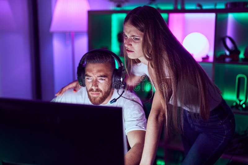 Young Couple Playing Video Games Clueless and Confused Expression Stock ...