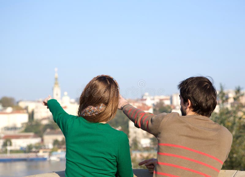 Young Couple Pointing Fingers into the Distance Stock Image - Image of ...