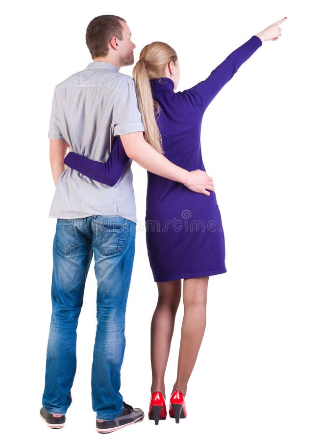 Back View of Walking Young Couple (man and Woman) Pointing. Stock Photo ...